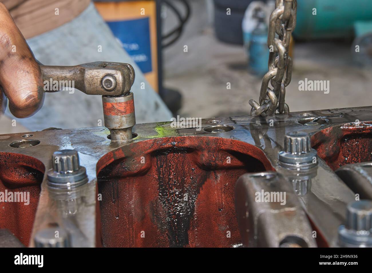 Front View Auto Mechanic or Car Mechanic Tight Cylinder Block Bolt by ...