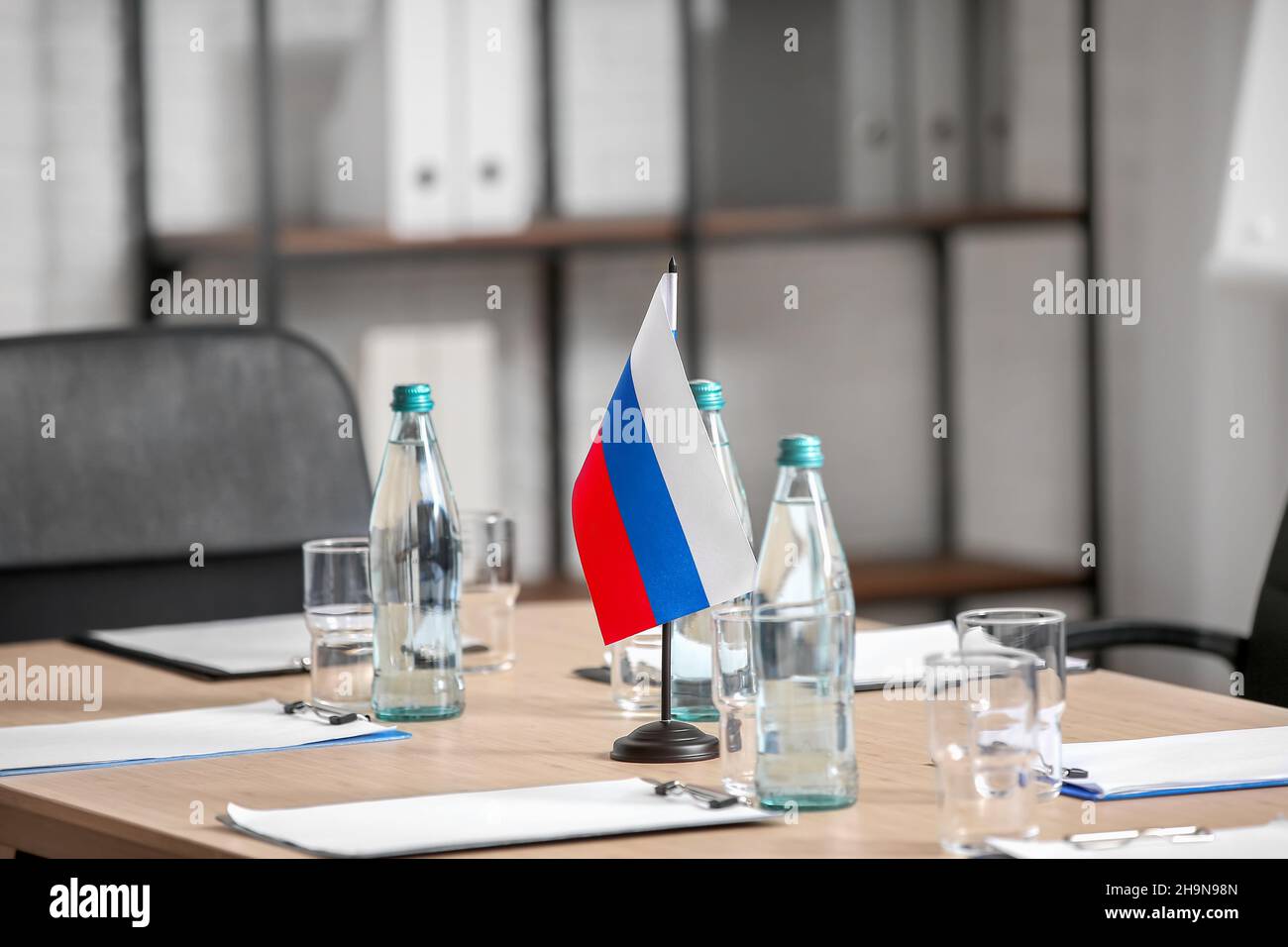 Russian flag on table in conference room Stock Photo - Alamy