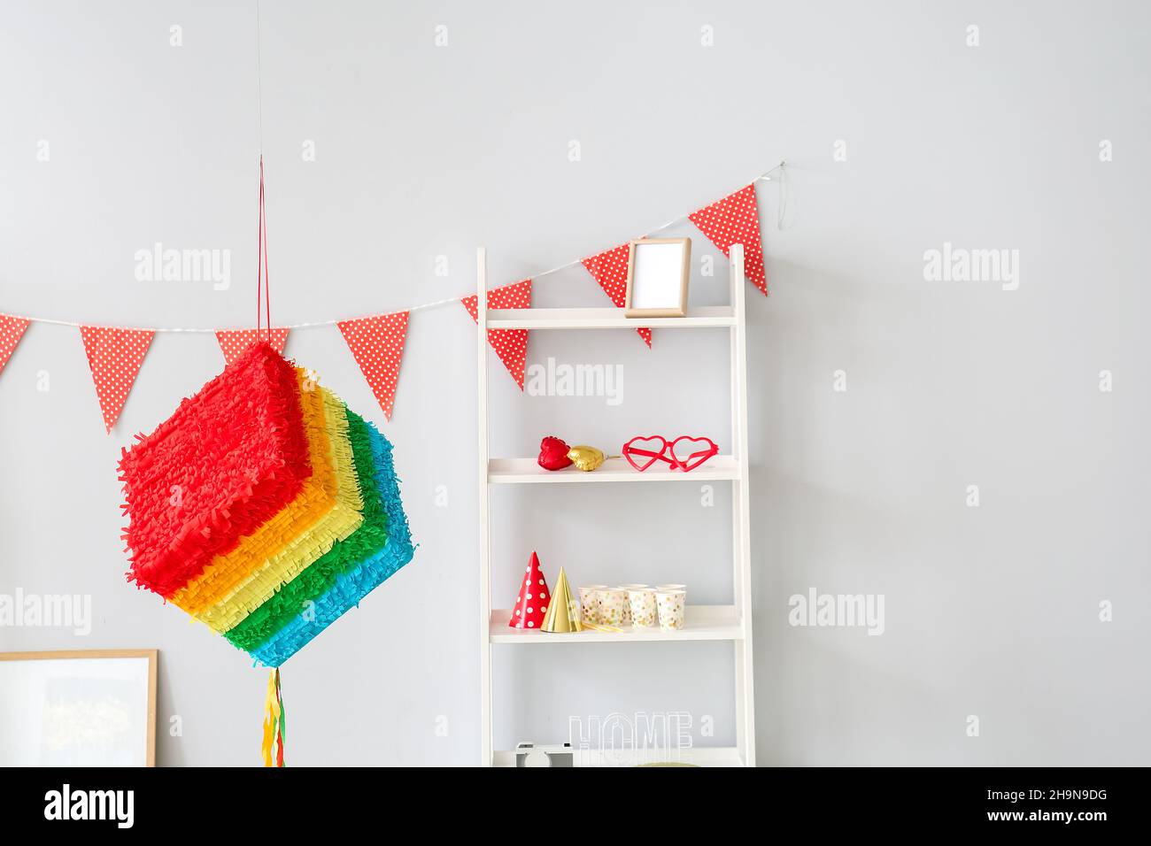 Mexican pinata hanging in light room decorated for Birthday party Stock ...