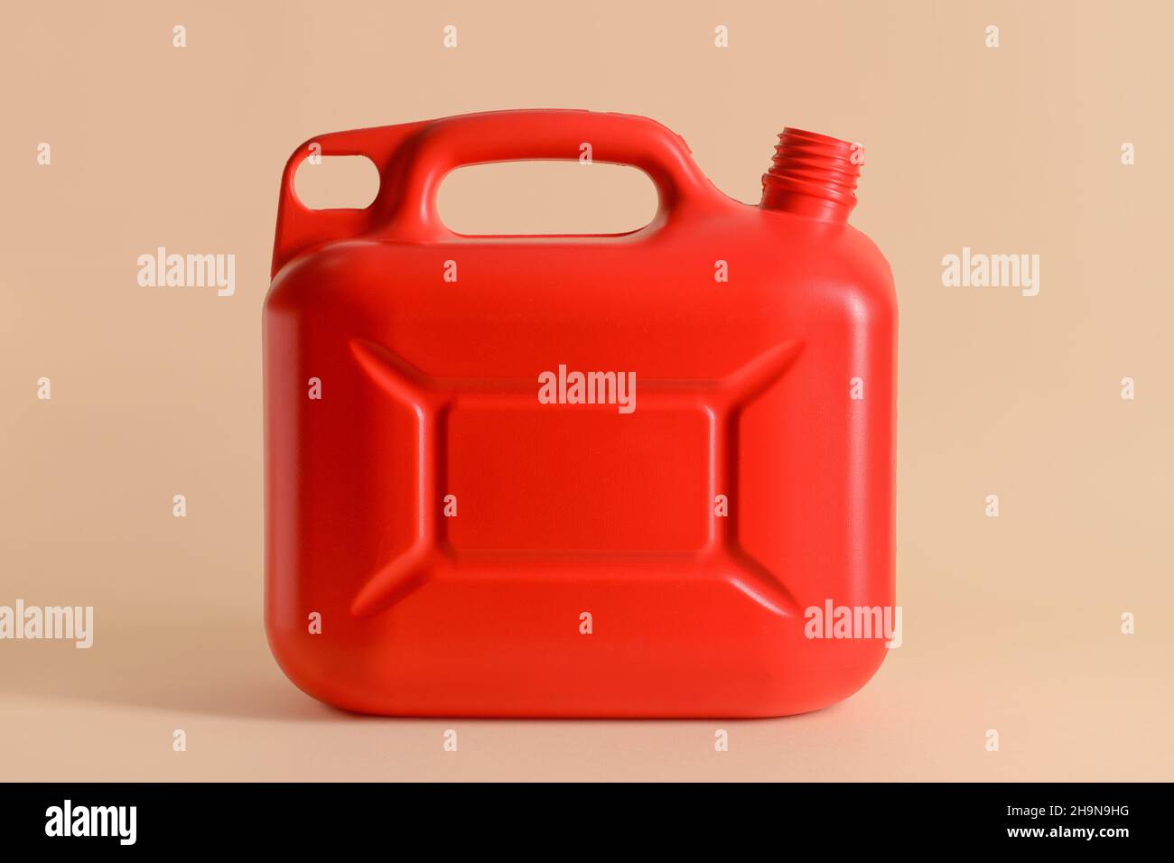 Plastic jerrycan on color background Stock Photo - Alamy