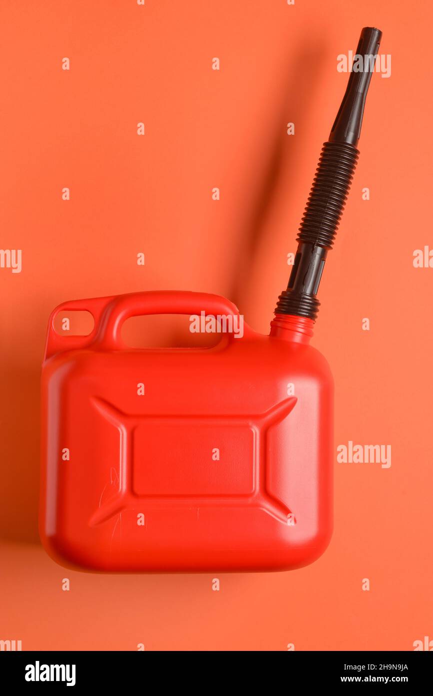 Plastic jerrycan on color background Stock Photo - Alamy