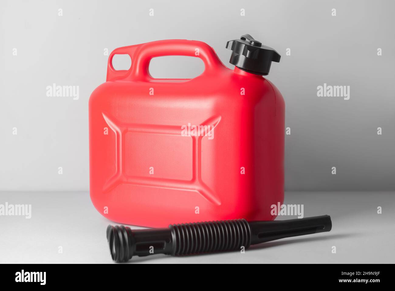 Plastic jerrycan on grey background Stock Photo - Alamy