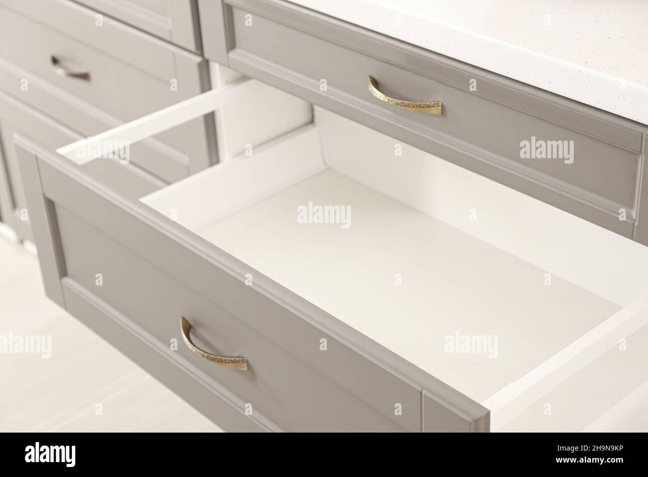 Opened white kitchen drawer hi-res stock photography and images - Alamy