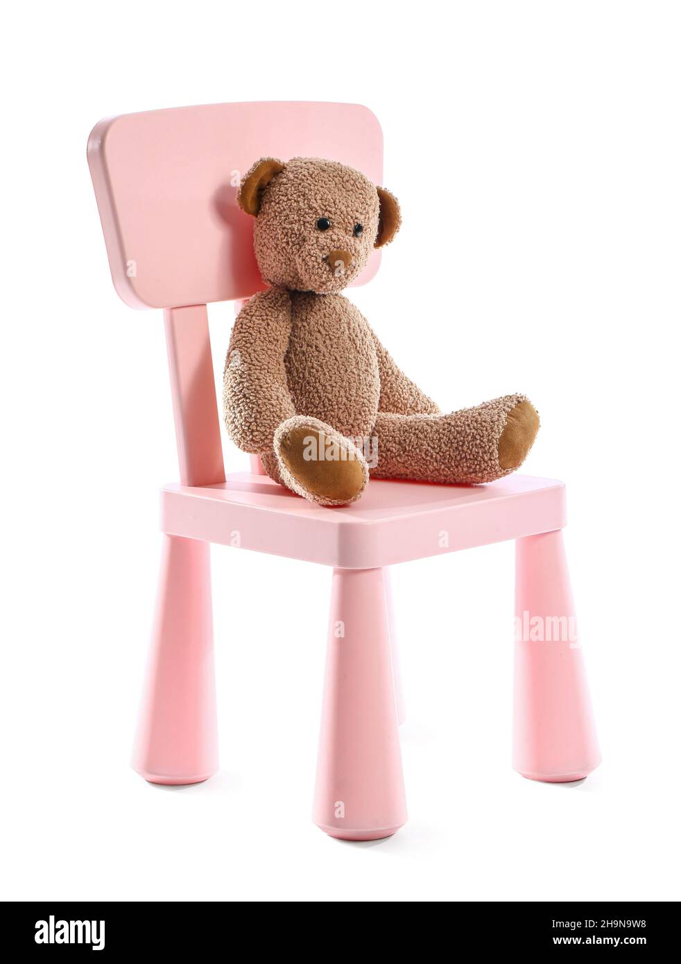 Chair with toy on white background Stock Photo - Alamy