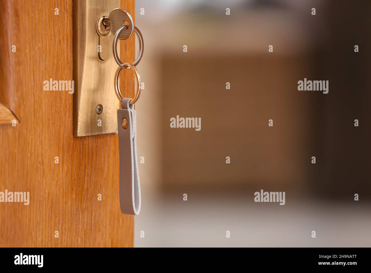 Key inserted in door hole, closeup Stock Photo - Alamy