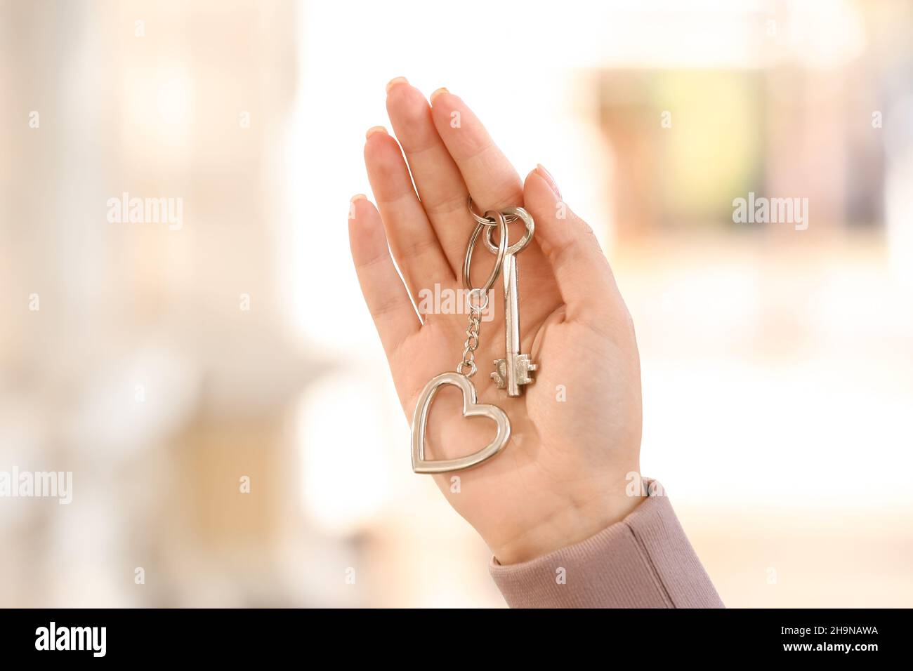 Female hand holding key heart hi-res stock photography and images - Alamy