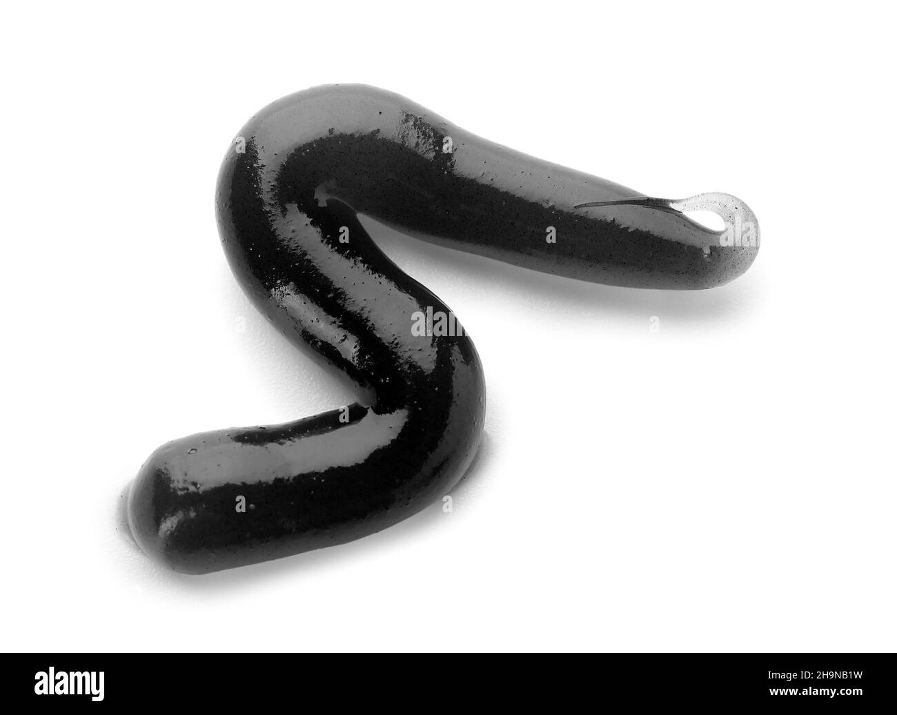 Sample of black toothpaste on white background Stock Photo - Alamy