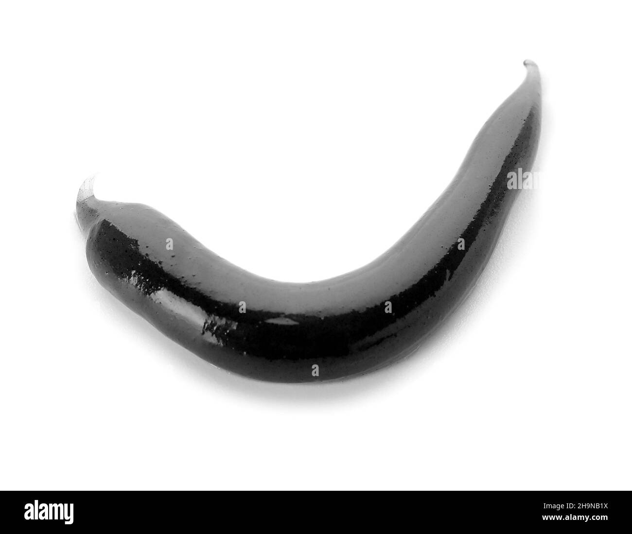 Sample of black toothpaste on white background Stock Photo - Alamy