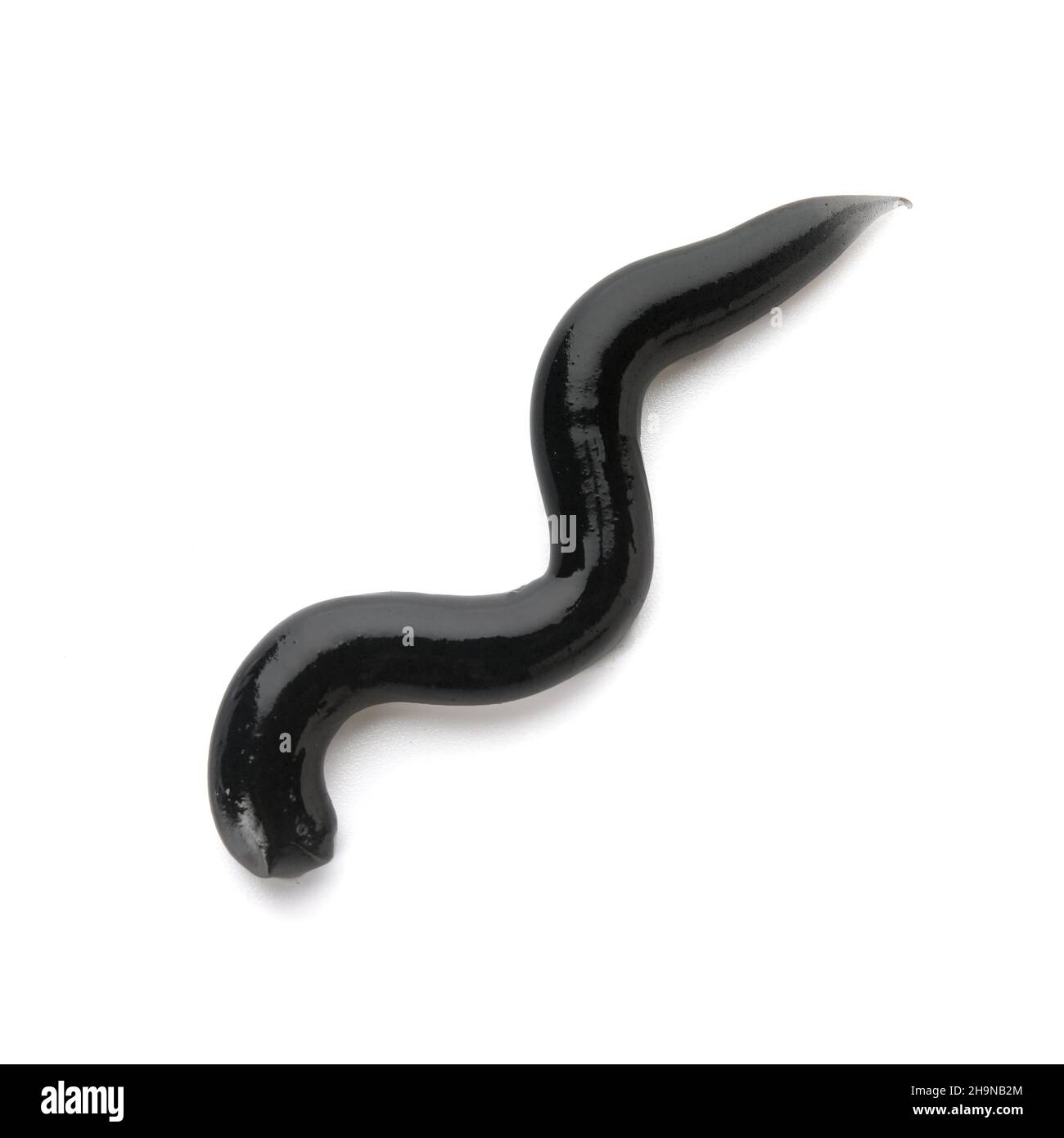 Sample of black toothpaste on white background Stock Photo - Alamy