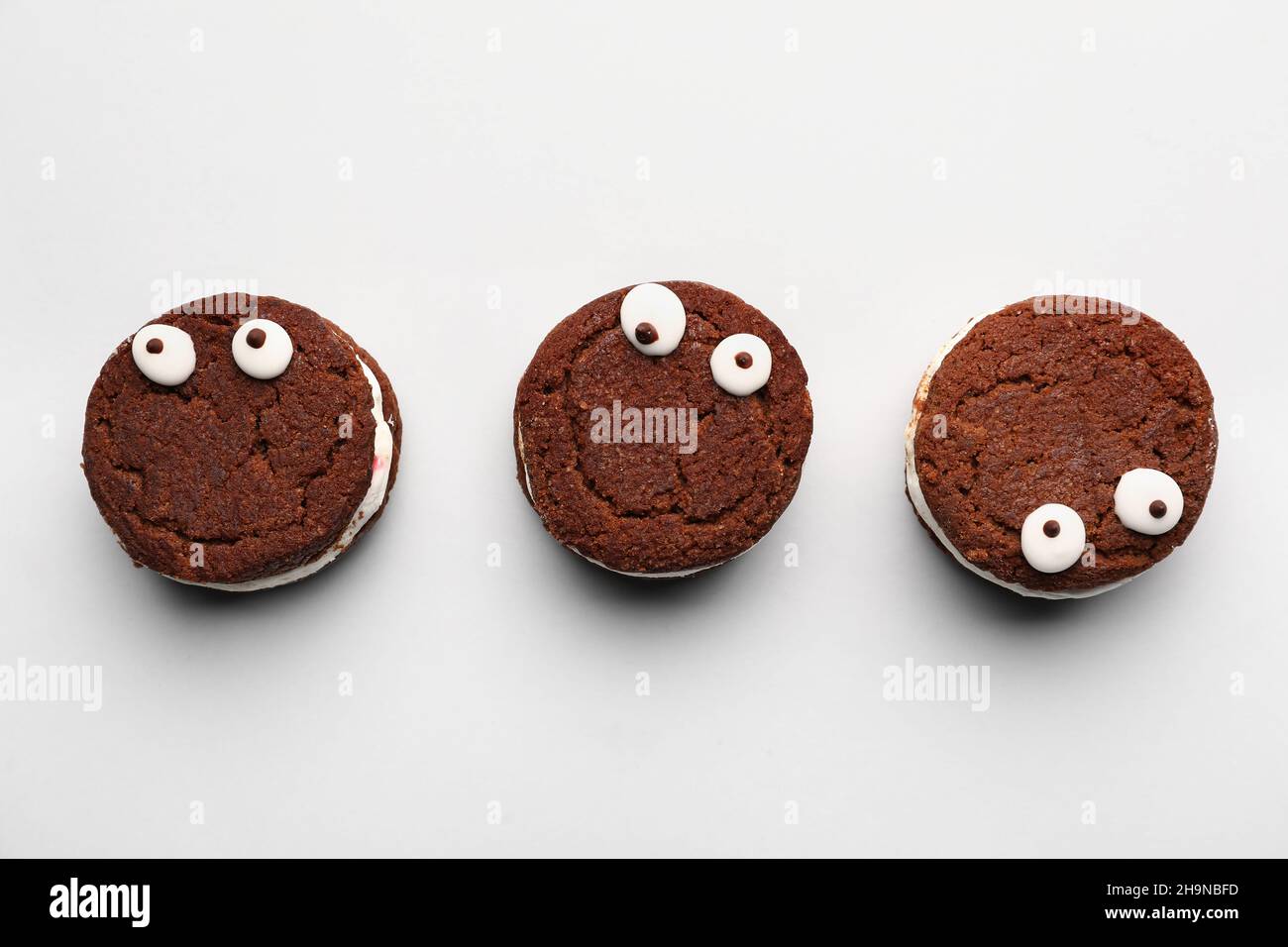 Funny cookies on light background Stock Photo - Alamy