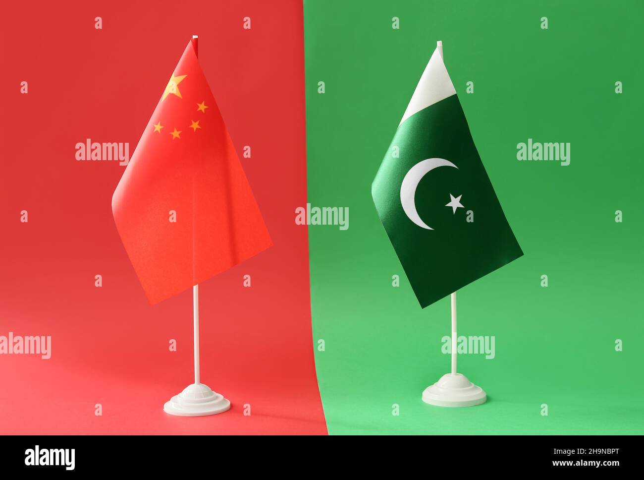 Flags of China and Pakistan on color background Stock Photo - Alamy