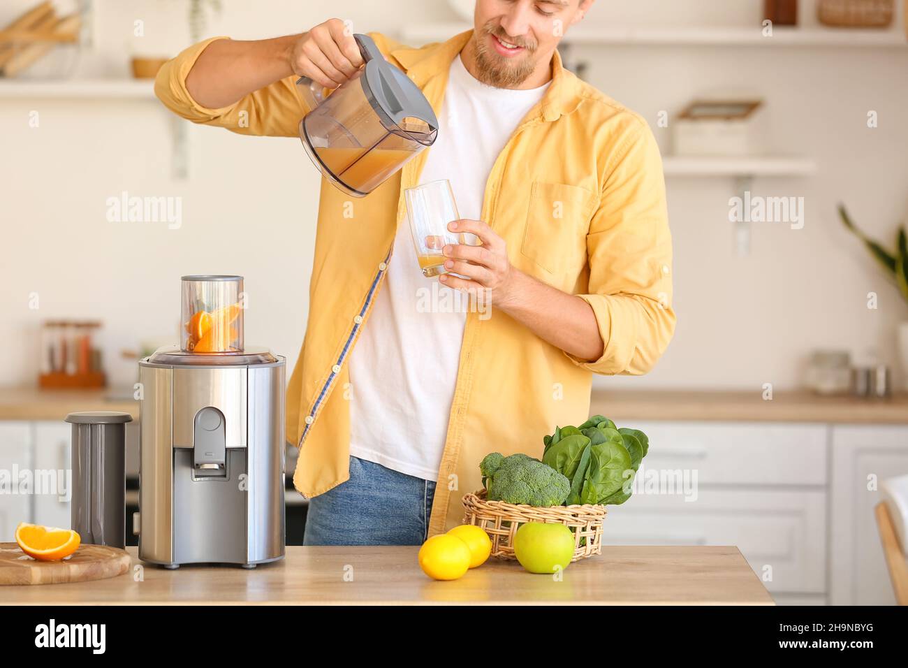 Handsome man pouring in preparing hi-res stock photography and images ...