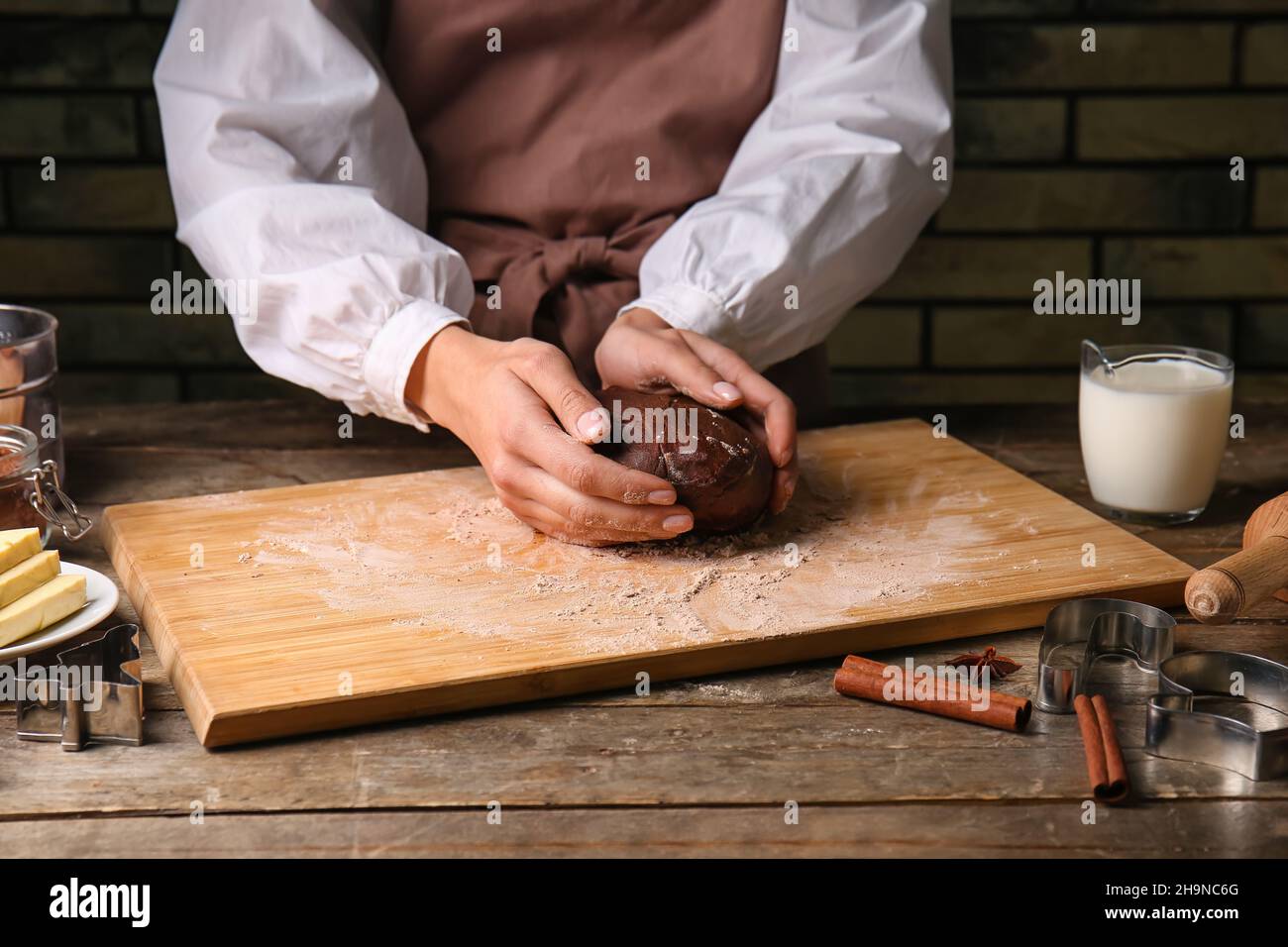 Woman preparing chocolate dough at kitchen table, closeup Stock Photo ...