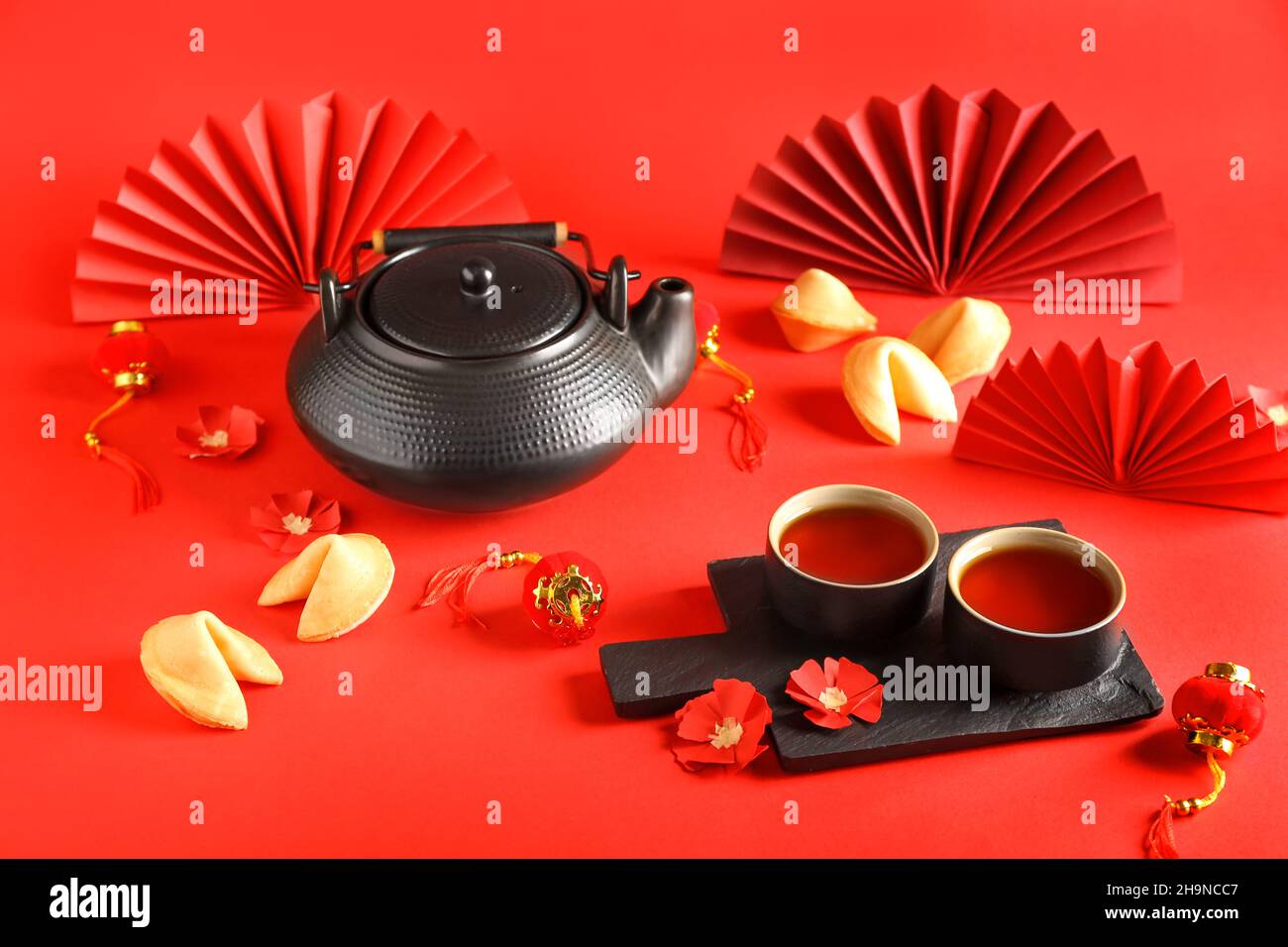 Tasty tea with Chinese symbols on color background Stock Photo - Alamy