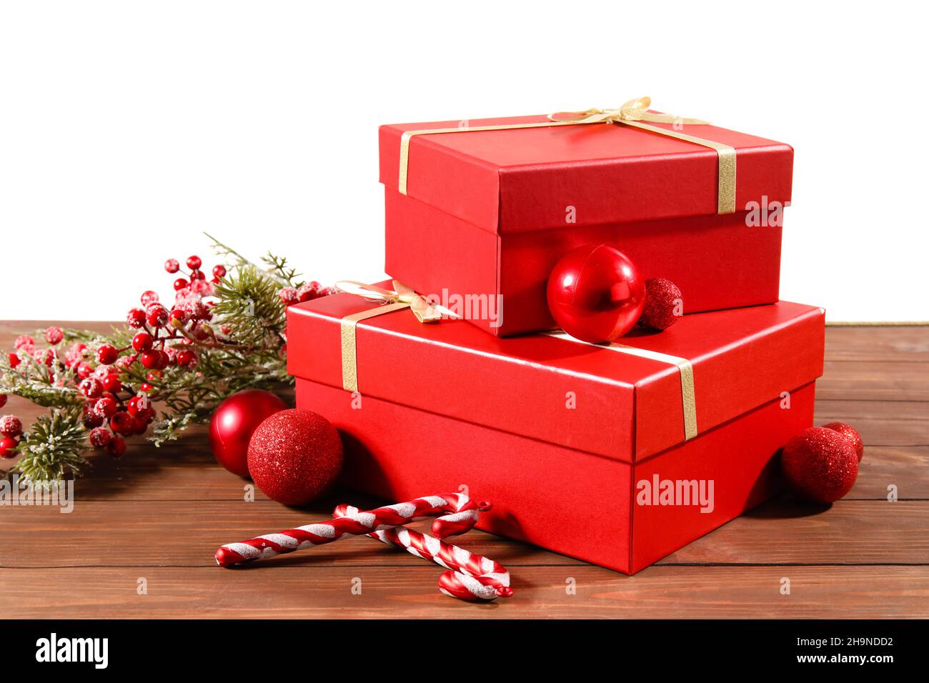 Beautiful Christmas composition with gift boxes, decor and fir branches ...