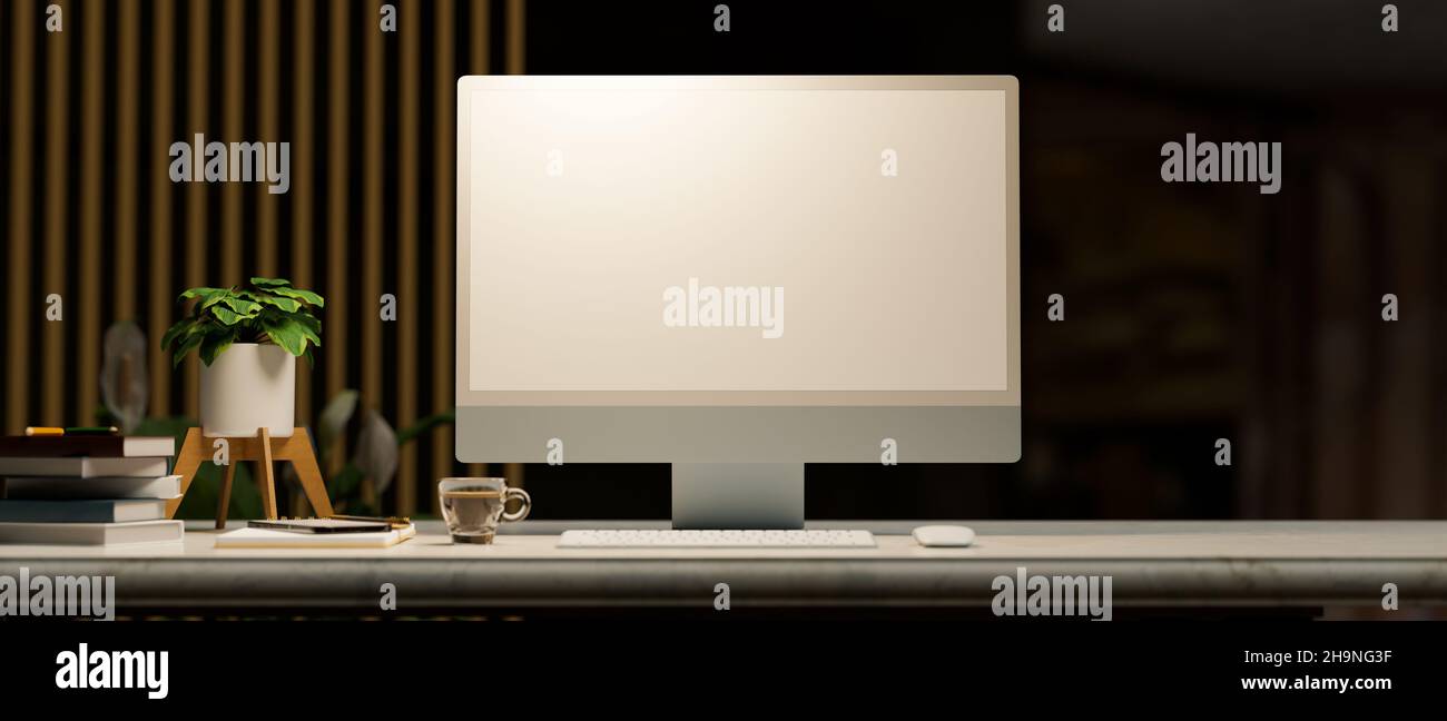 Modern white screen pc computer mockup on working desk over dark living ...