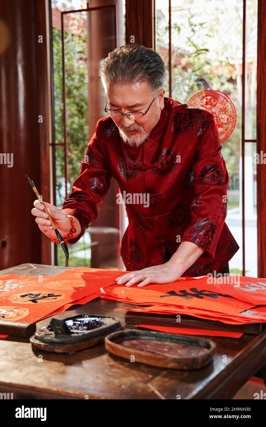Older men write calligraphy Stock Photo - Alamy Older men write calligraphy Stock Photo - Alamy