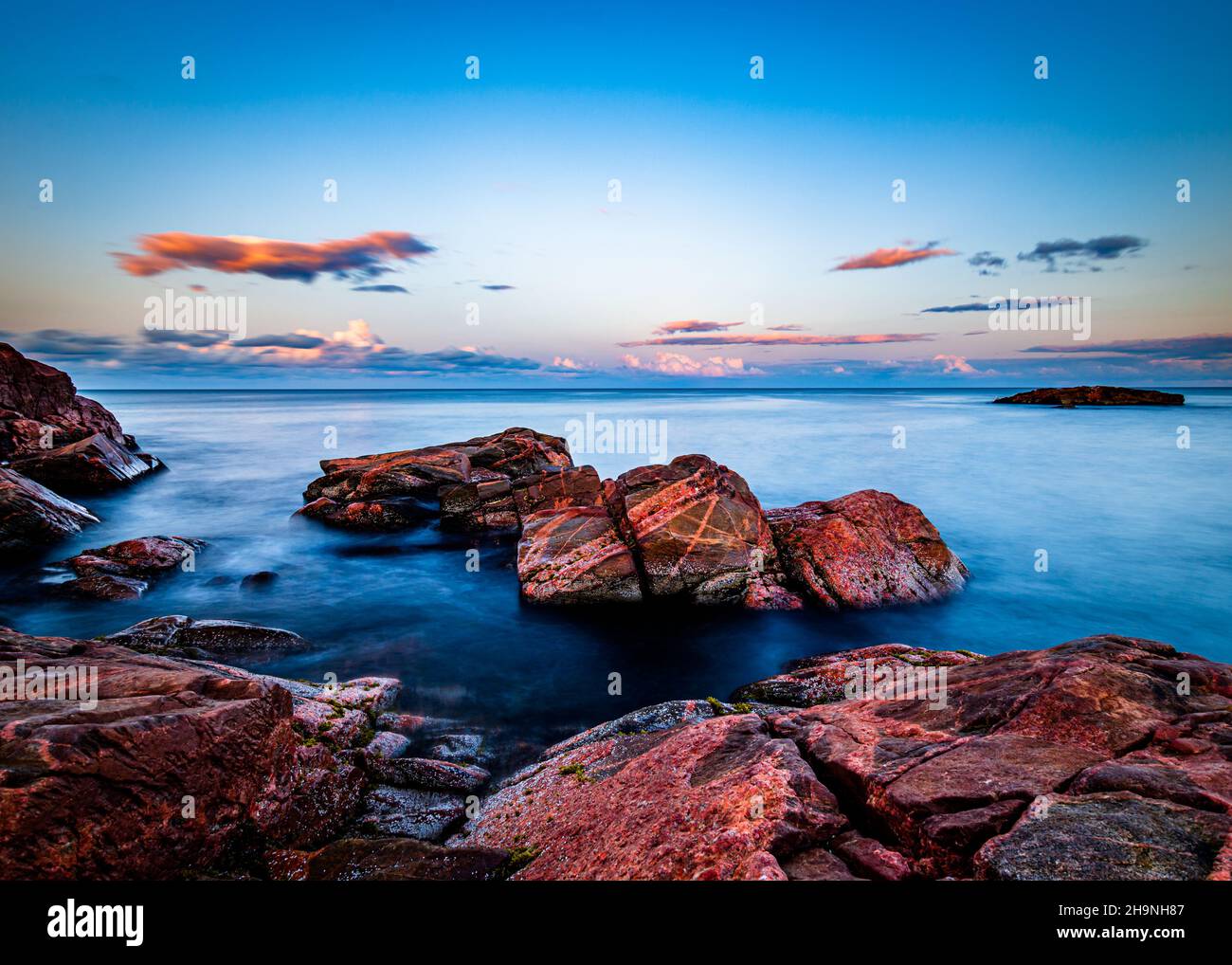 Sunrise over ocean rocks cape hi-res stock photography and images - Alamy