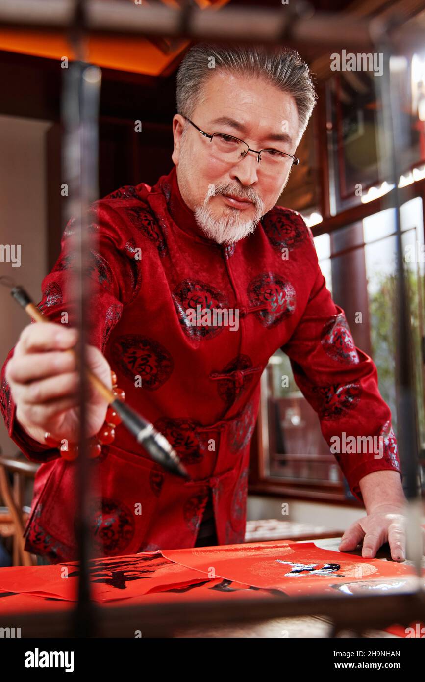 Older men write calligraphy Stock Photo - Alamy Older men write calligraphy Stock Photo - Alamy