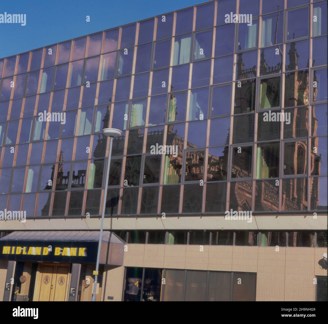 Reflection of Holy Trinity Church, Hull in windows of Midland Bank ...