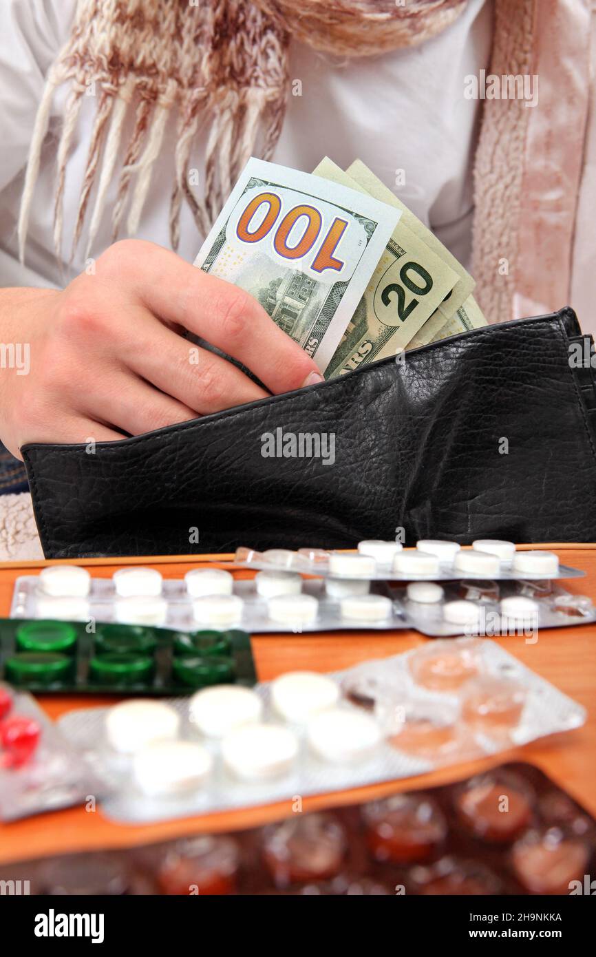 Sick Person checking the Wallet with a Money Stock Photo - Alamy