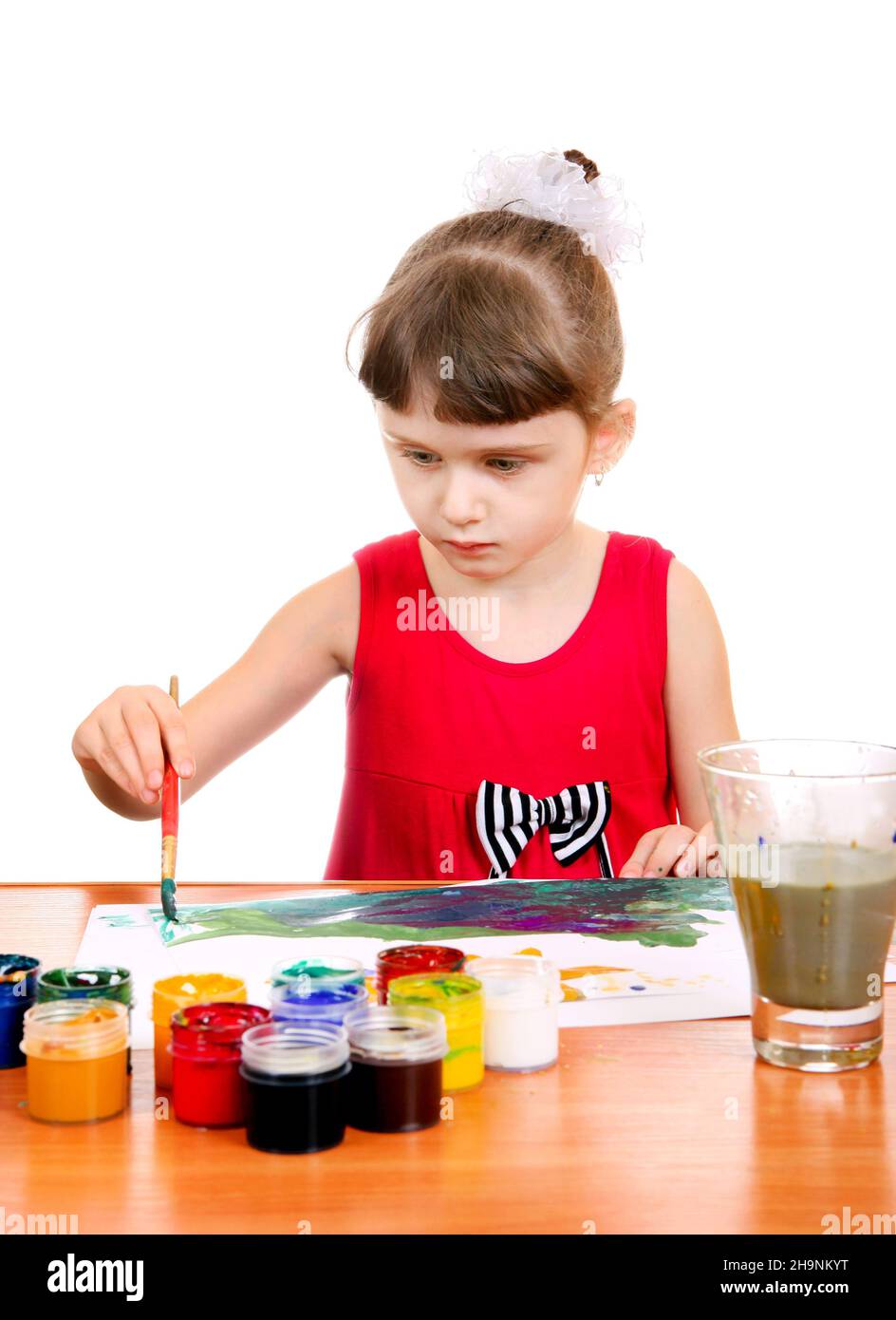 Concentrated Little Girl Drawing Isolated on the white background Stock ...