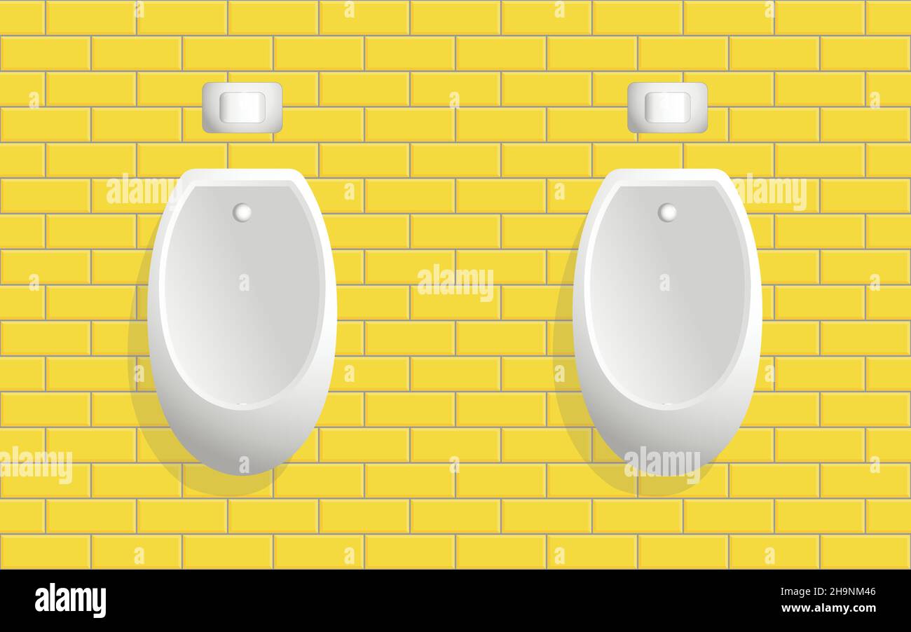 Public toilet. Two male urinals on the wall on a yellow tiled wall ...