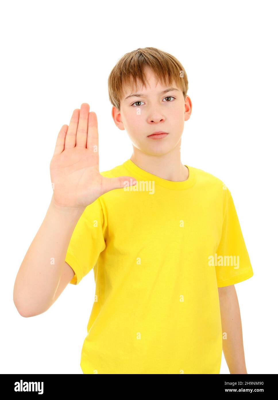 Serious Boy shows Stop hand gesture Isolated on the White Background ...