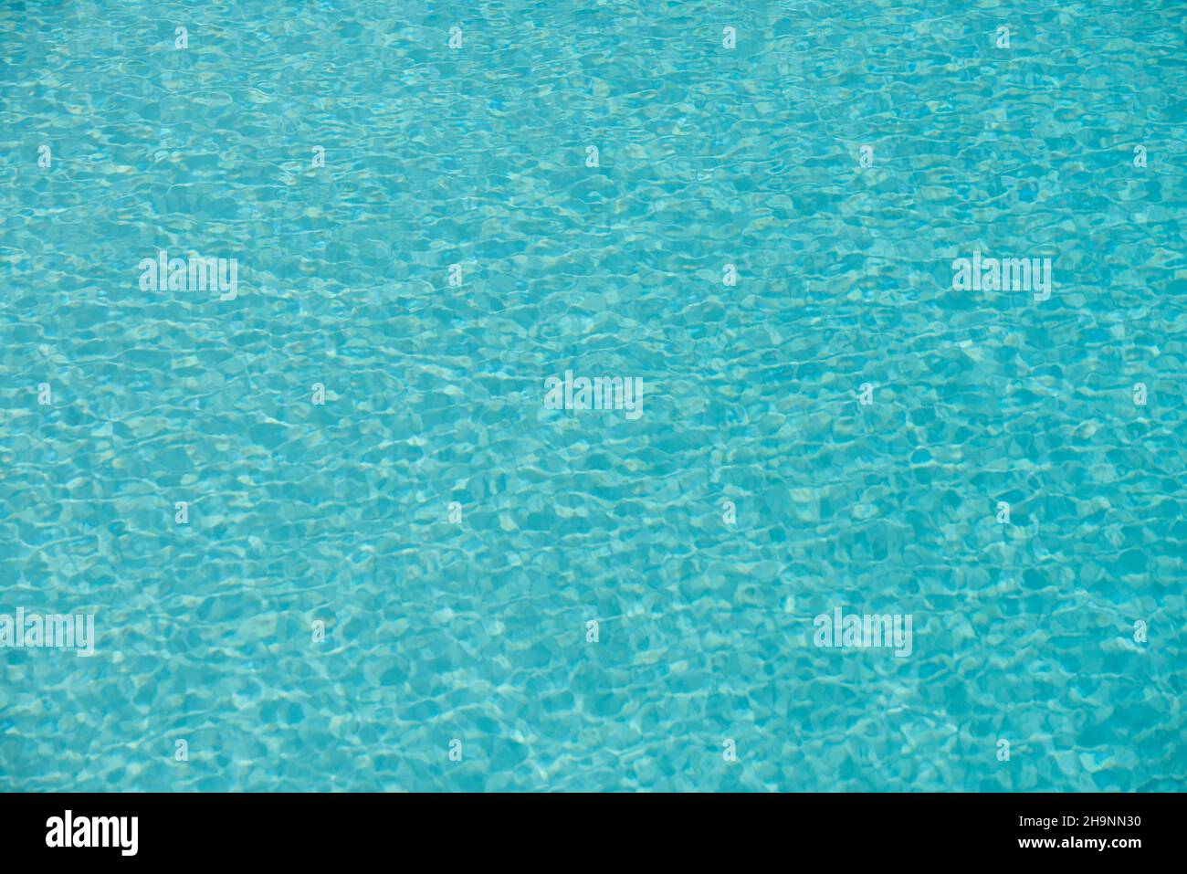 Ripple Water in swimming pool with sun reflection. Wavy water ...