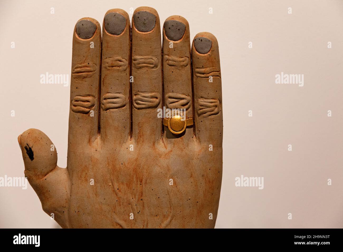 hand of clay with six fingers Stock Photo - Alamy