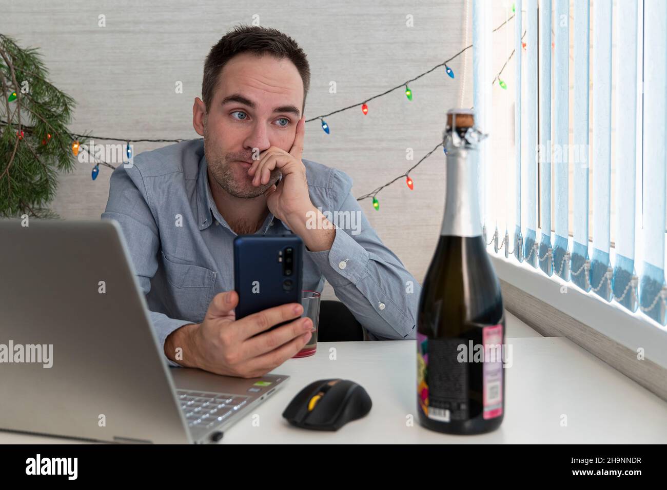Young businessman drinking from stress. alcoholism in the workplace. a ...