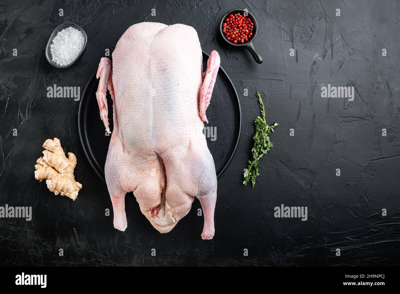 Raw duck fresh meat on black background, flat lay, with copy space ...