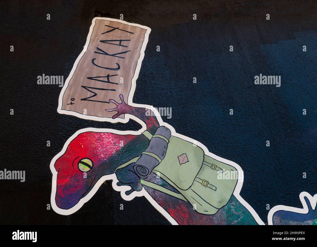 street art of a gecko holding a sign welcoming you to Mackay Stock ...