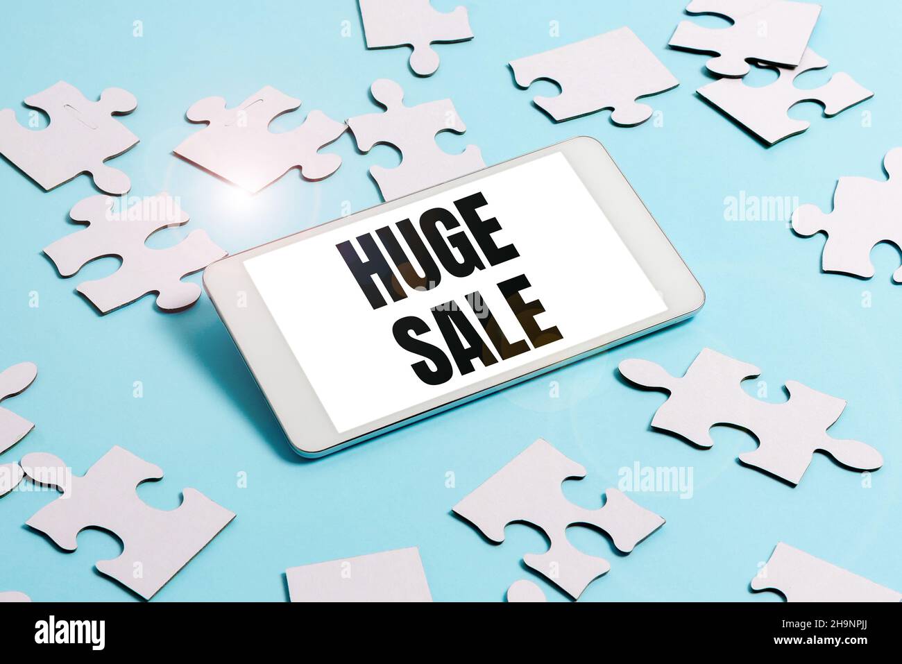 Hand writing sign Huge Sale. Word Written on putting products on high ...