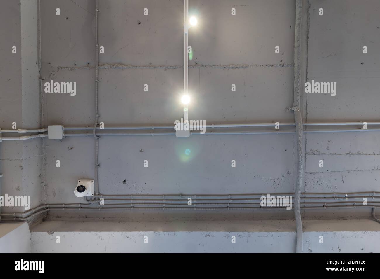 Abstract loft interior of concrete grey ceiling with air ventilation ...
