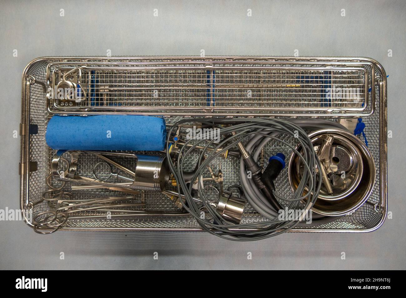 packed instrument tray for performing a urological resection is open in ...