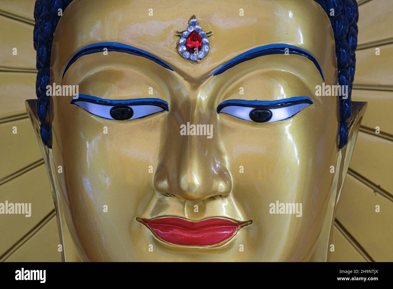 The head of a Buddha statue placed outside a factory-cum-outlet for ...