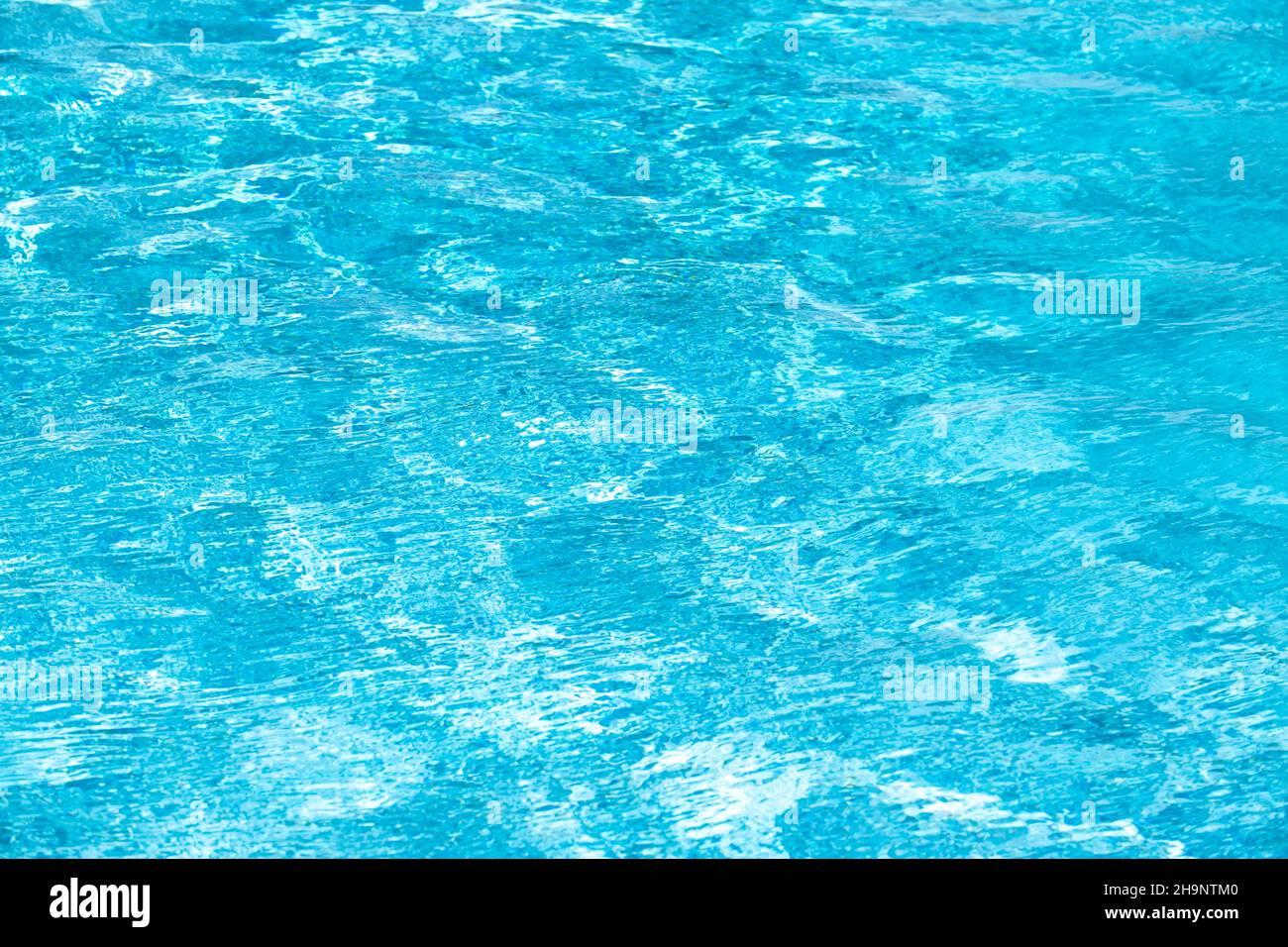 Background of blue water in swimming pool with sun reflection, ripple ...