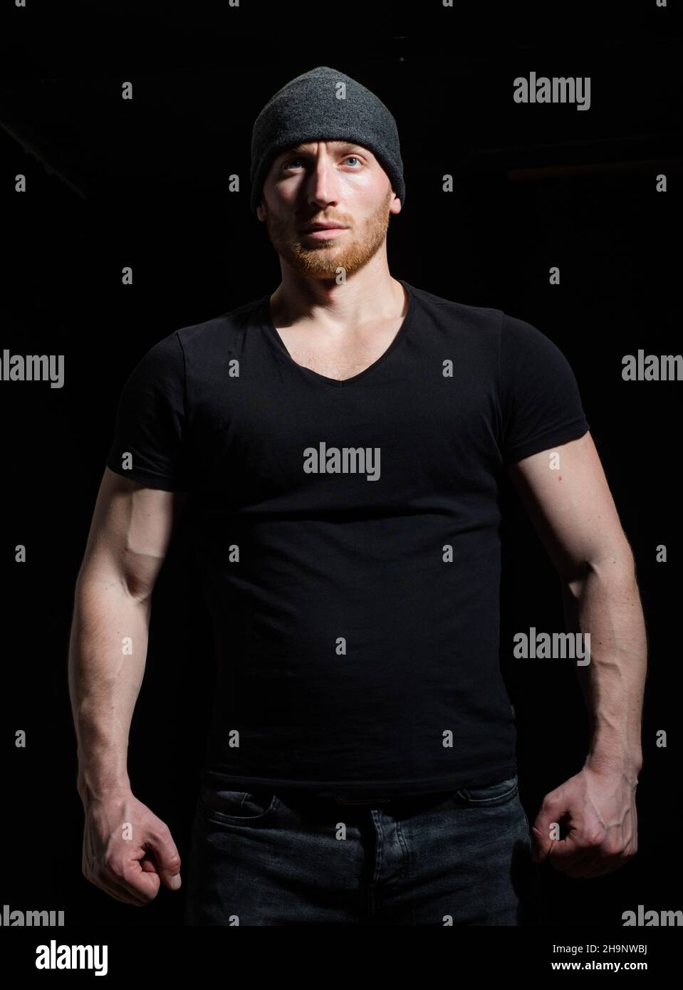 Brutal angry gang man lifestyle, serious handsome guy on black Stock ...