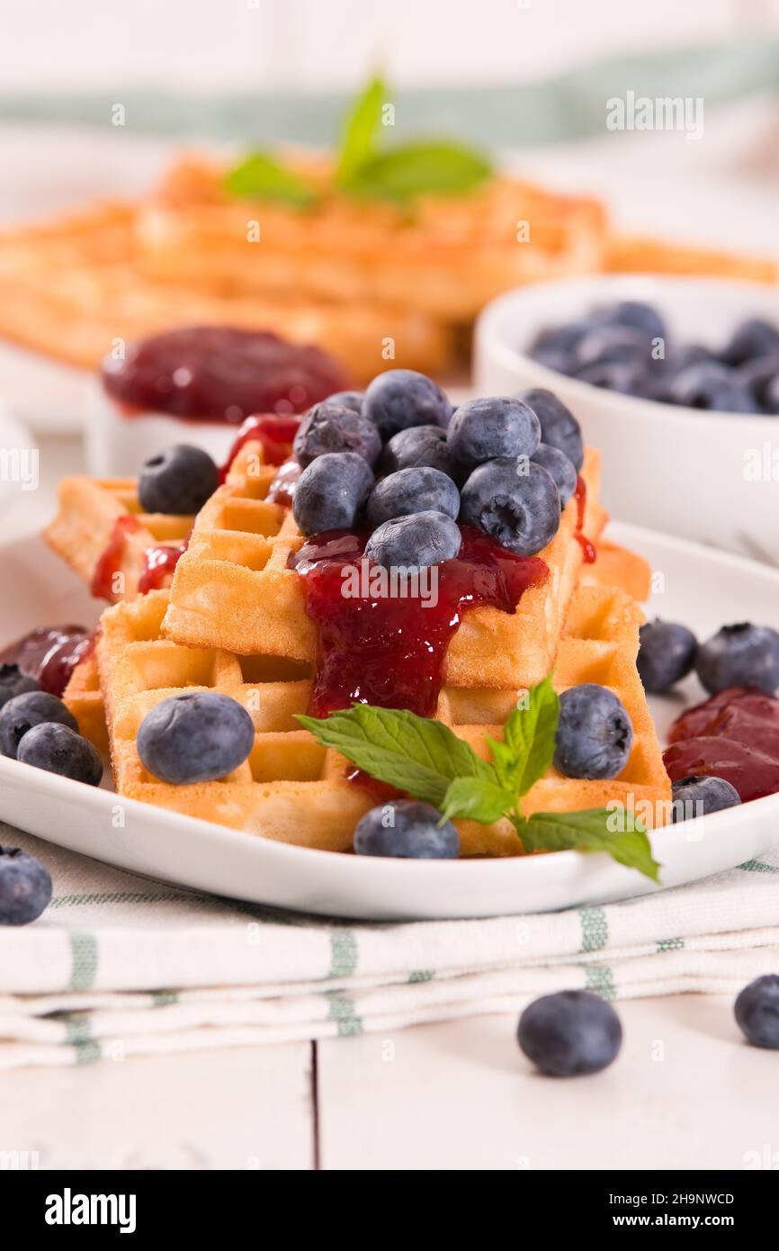 Waffles with blueberries and jam Stock Photo - Alamy