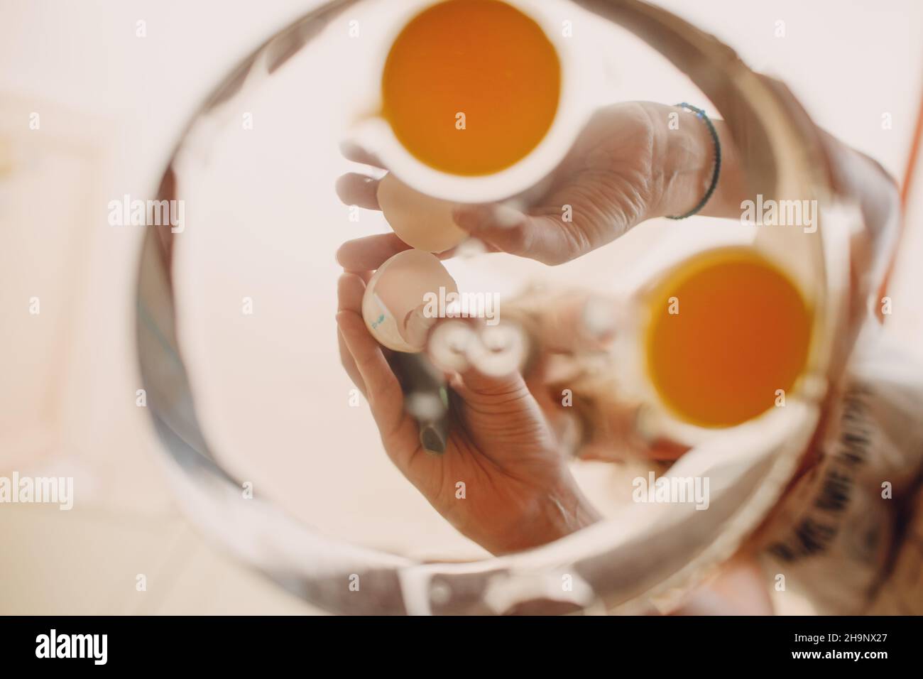 Pastry chef makes cake. Cooking and beat mixing eggs. Inside bottom ...