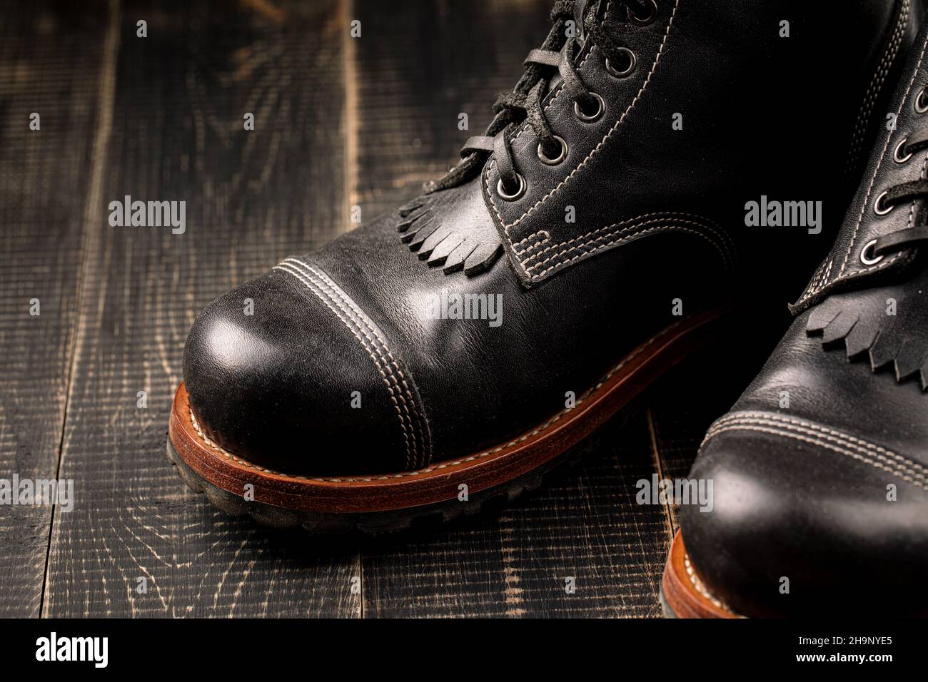 Hand crafted black leather high boots Stock Photo - Alamy