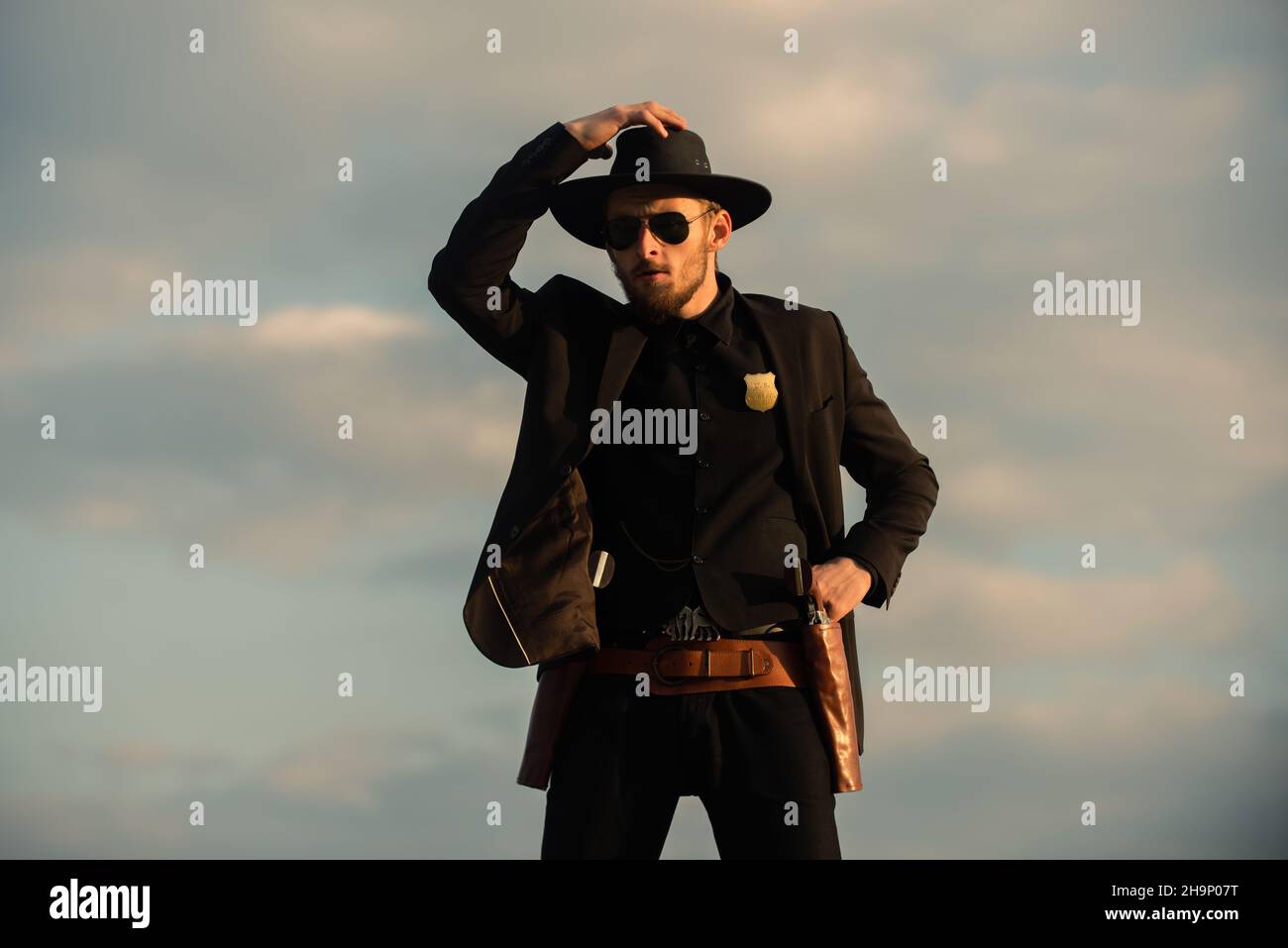 Cowboy shooter in cowboy hat. Serious man with wild west guns, retro ...