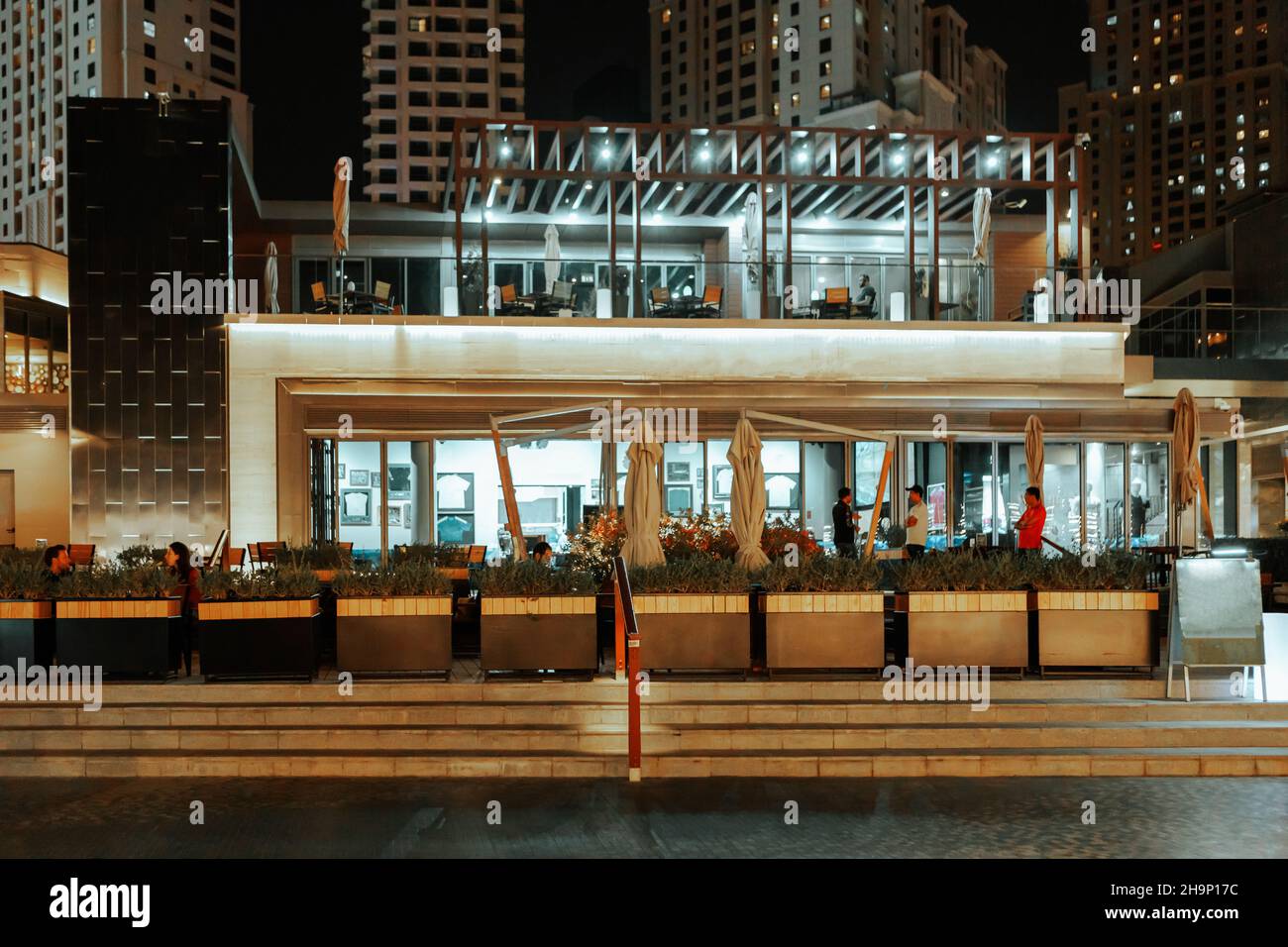 Street cafe at night. Dubai Marina. UAE Stock Photo - Alamy