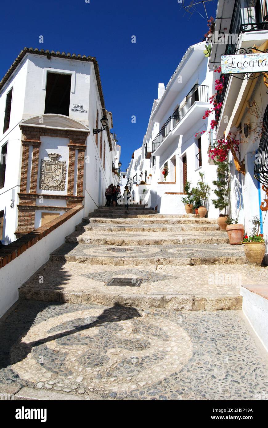 View along a traditional steep stepped village street, Frigiliana ...