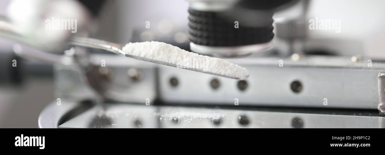 Study of white powder in a laboratory under microscope closeup Stock ...