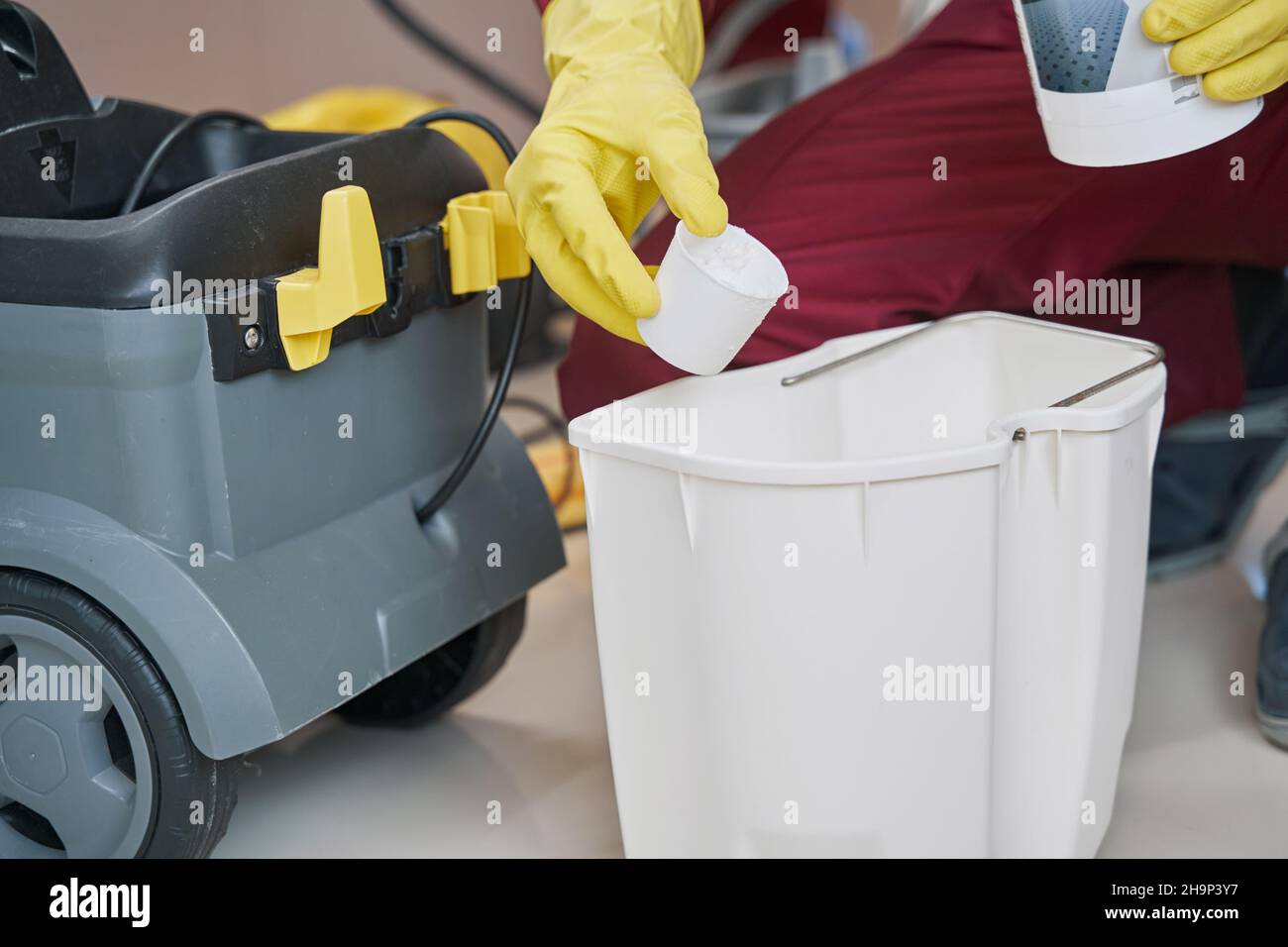 Professional cleaner getting ready for wet cleaning Stock Photo - Alamy