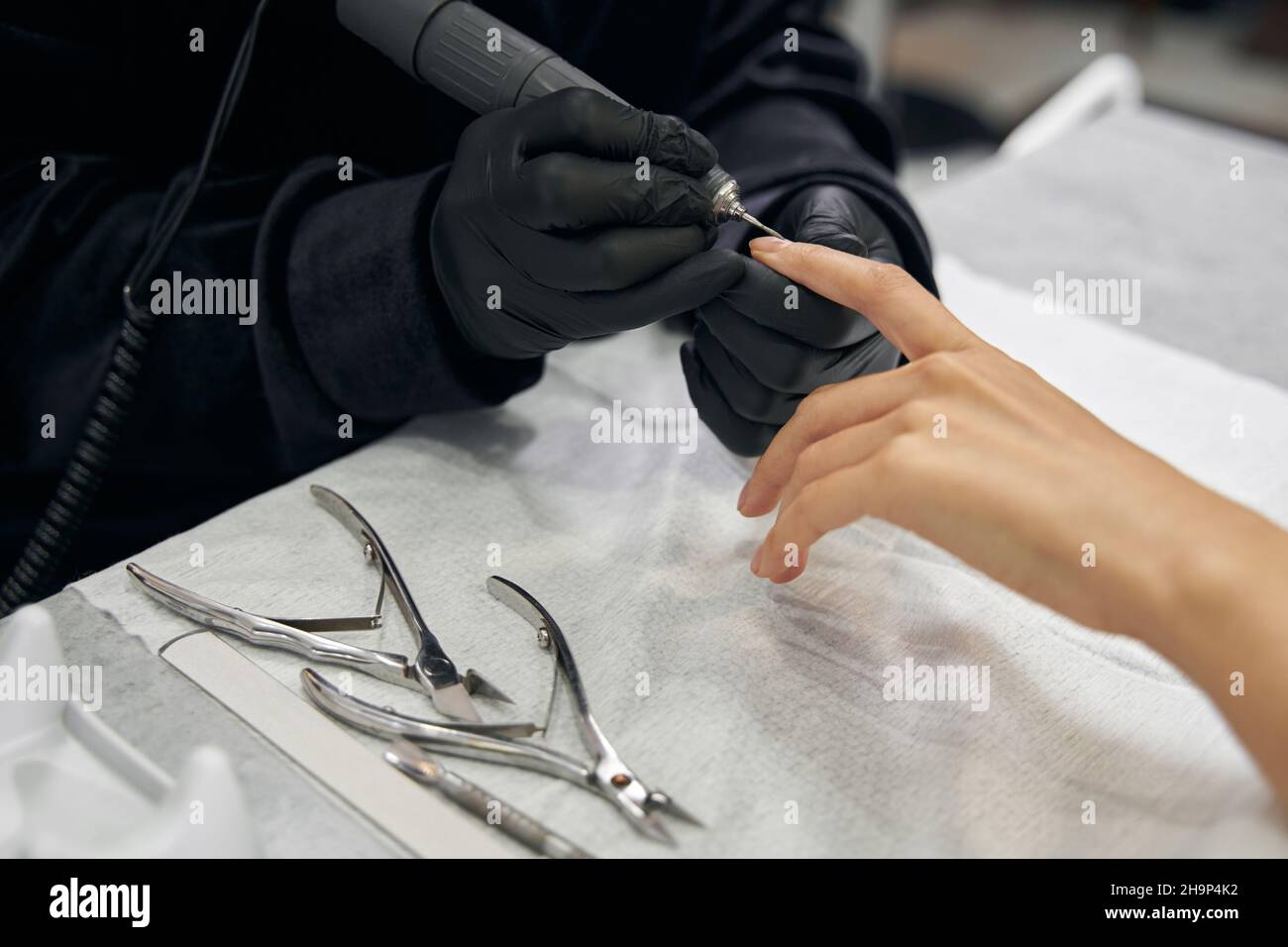 Elegant beautiful female arms during the manicure procedure Stock Photo ...