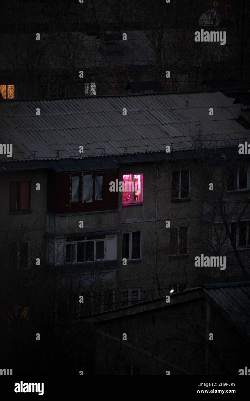 the window glows red in the house Stock Photo - Alamy