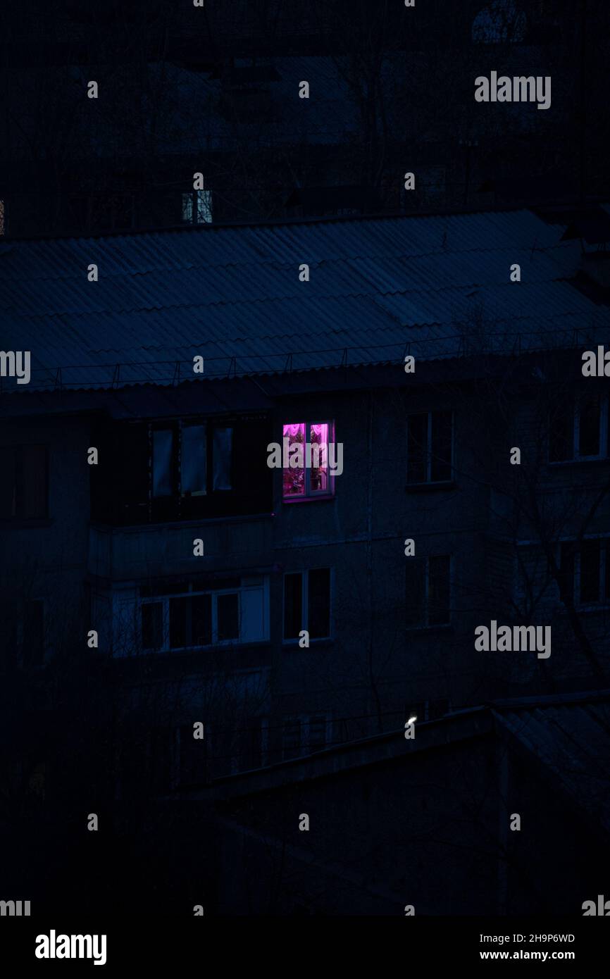 the window glows red in the house at night Stock Photo - Alamy